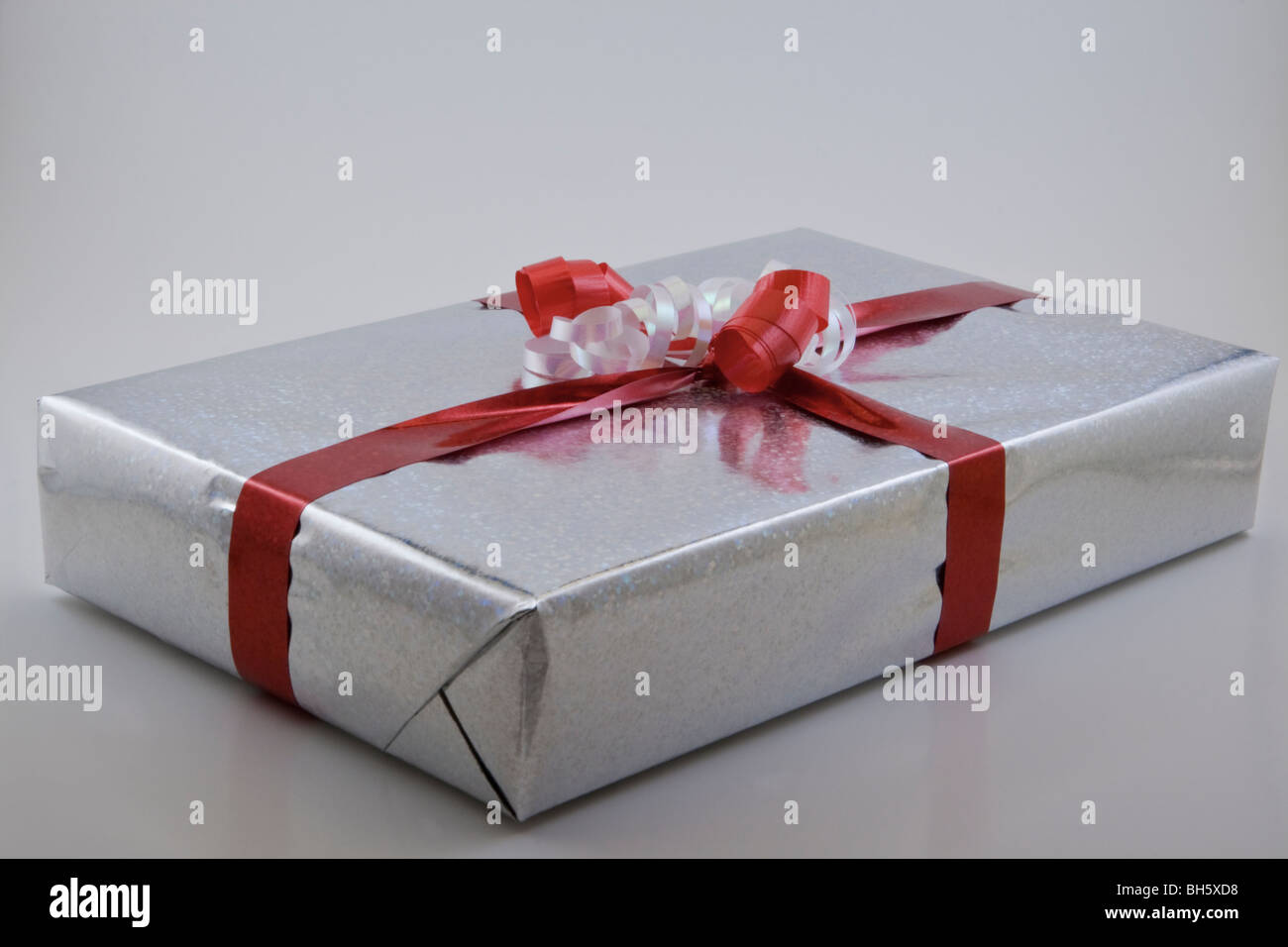 present in a gift wrapped box Stock Photo - Alamy