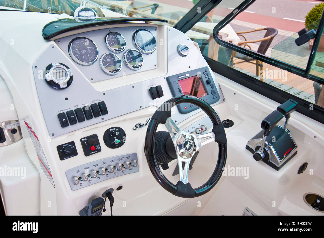 Cockpit with helm of a Sea Ray 305 powerboat / yacht, 2009 model Stock ...