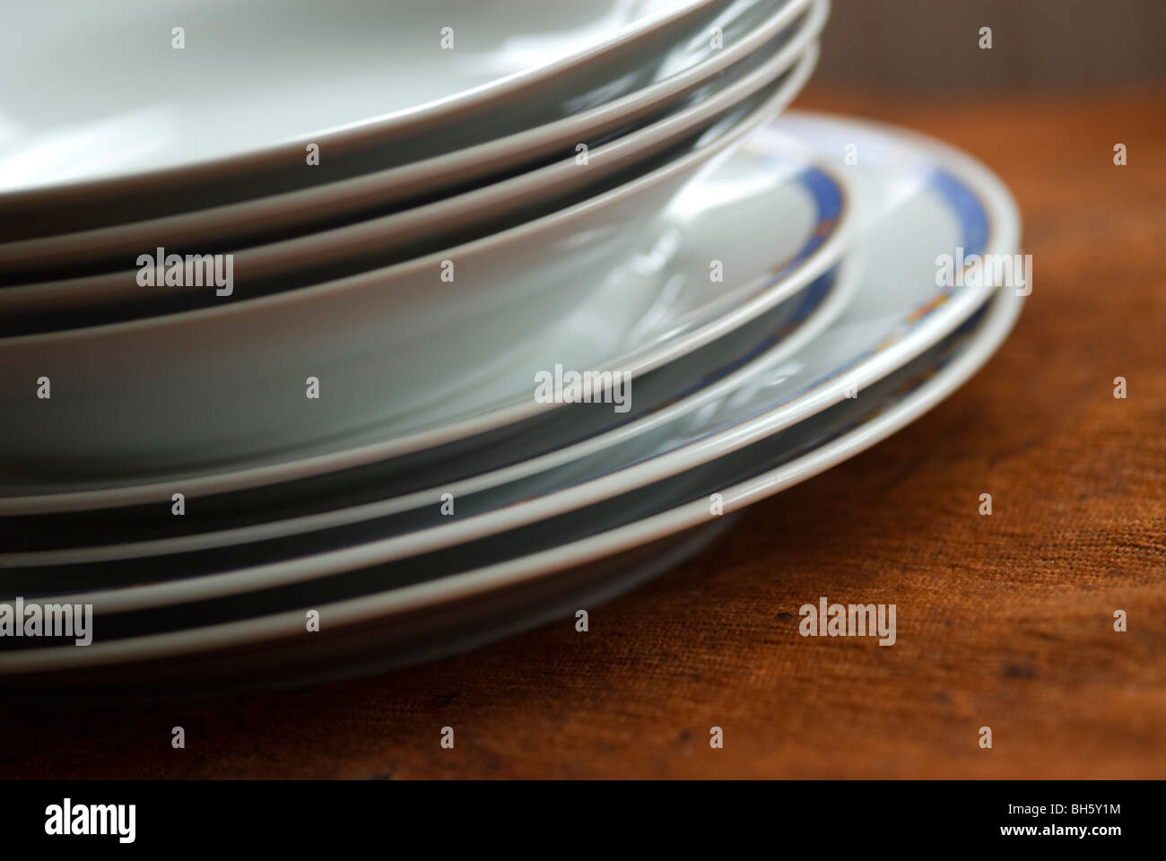 a close up image showing a small stack of plates and dishes Stock Photo ...