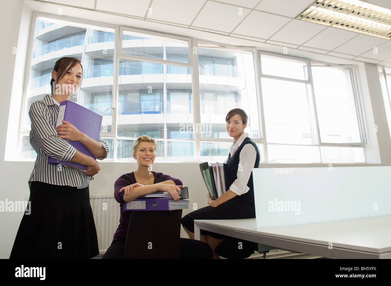 Portrait of three office girls Stock Photo - Alamy