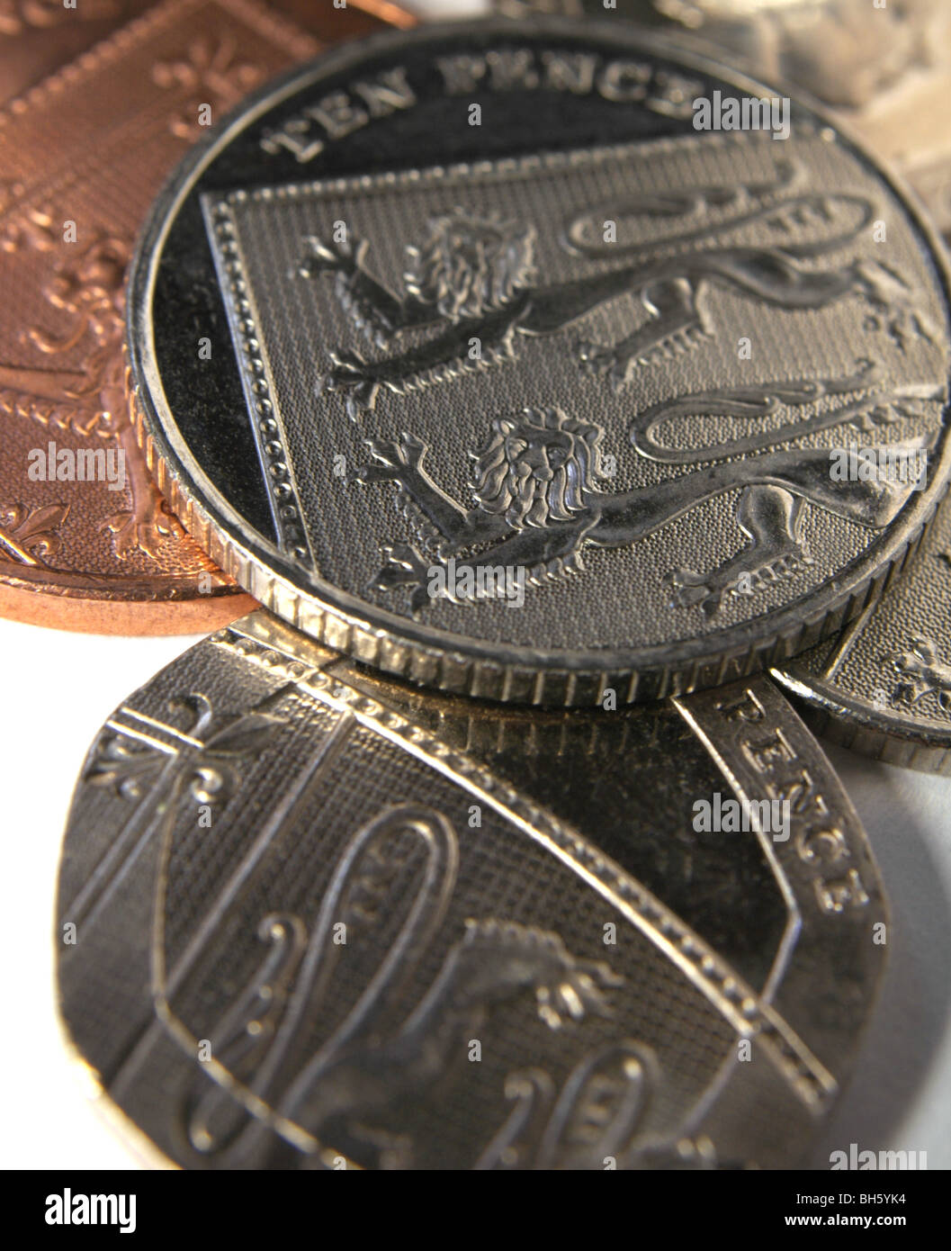 New British ten pence coin with lion motif and other coins under it ...