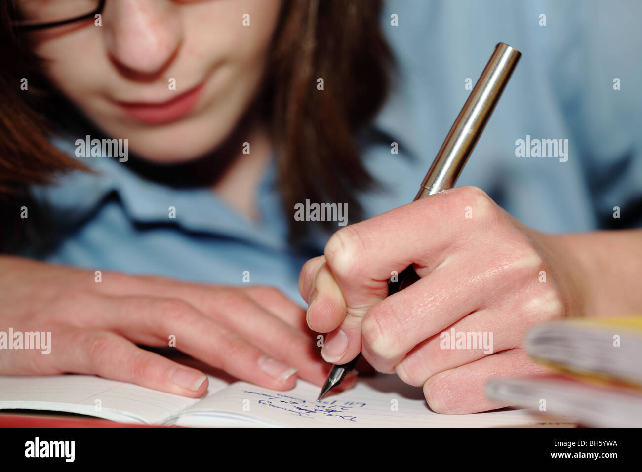 young girl doing school work Stock Photo - Alamy