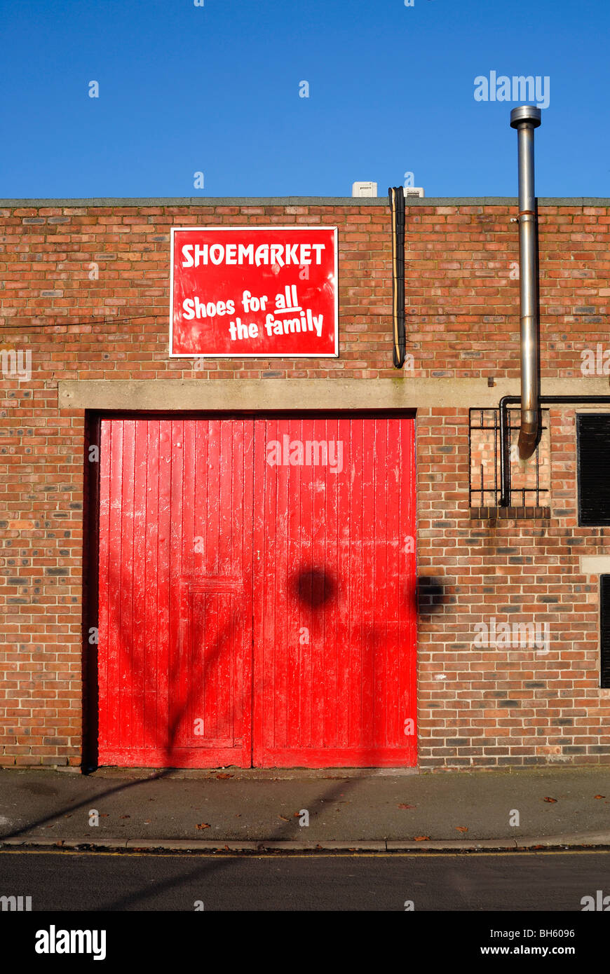 Bright red doors and red and white 'Shoemarket' sign Stock Photo - Alamy