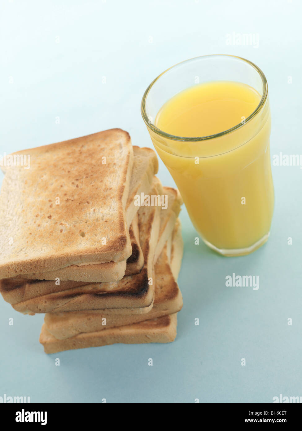 Plain white toast isolated against a pale blue background Stock Photo ...