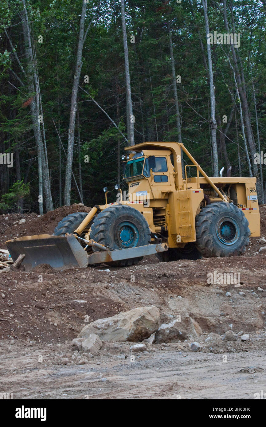 Bulldozer and dirt pile forest in Michigan USA nature spoil from above ...