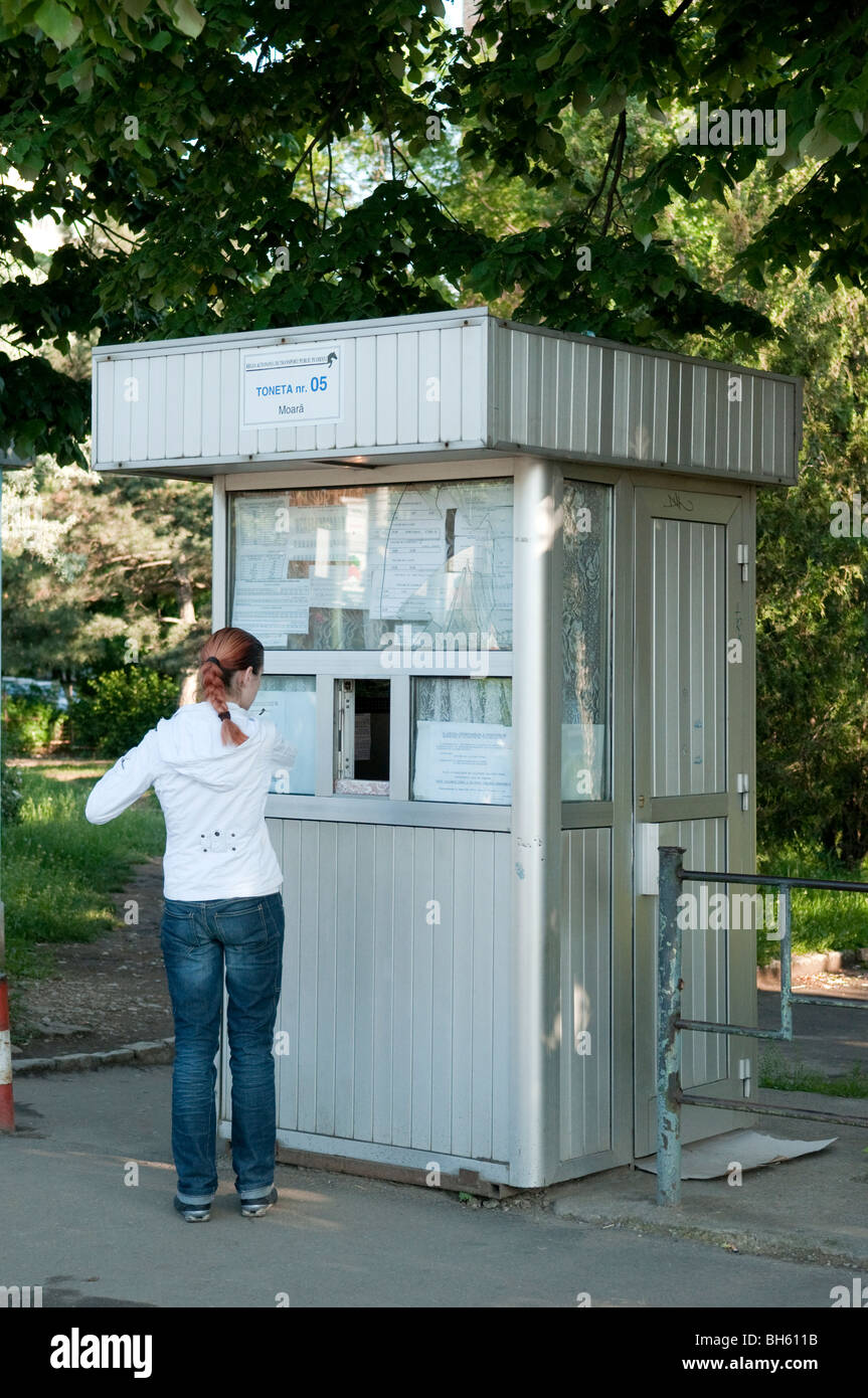 Woman buying bus ticket at booth in Romania Eastern Europe Stock Photo ...