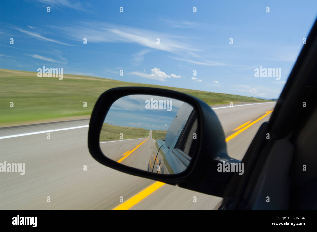 side mirror reflects roadway from inside car Stock Photo - Alamy