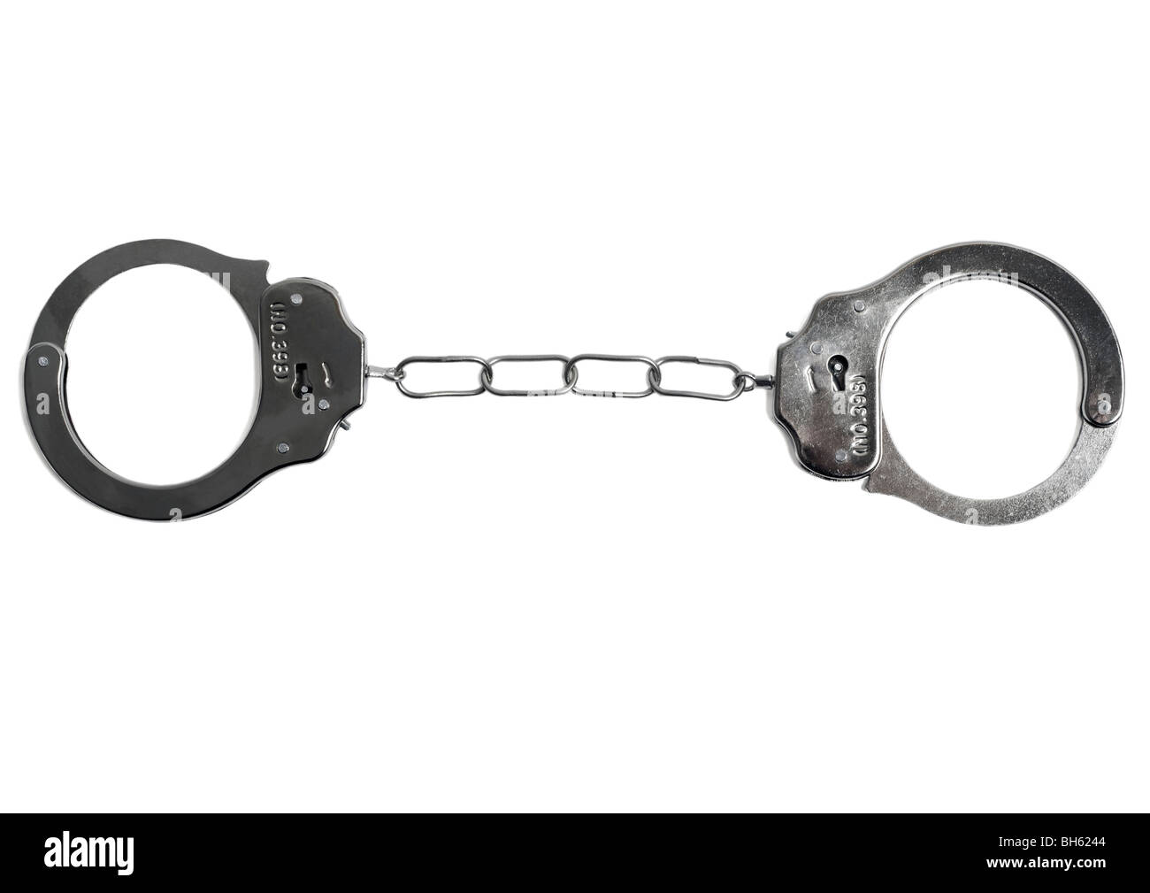 Handcuffs on white background Stock Photo - Alamy