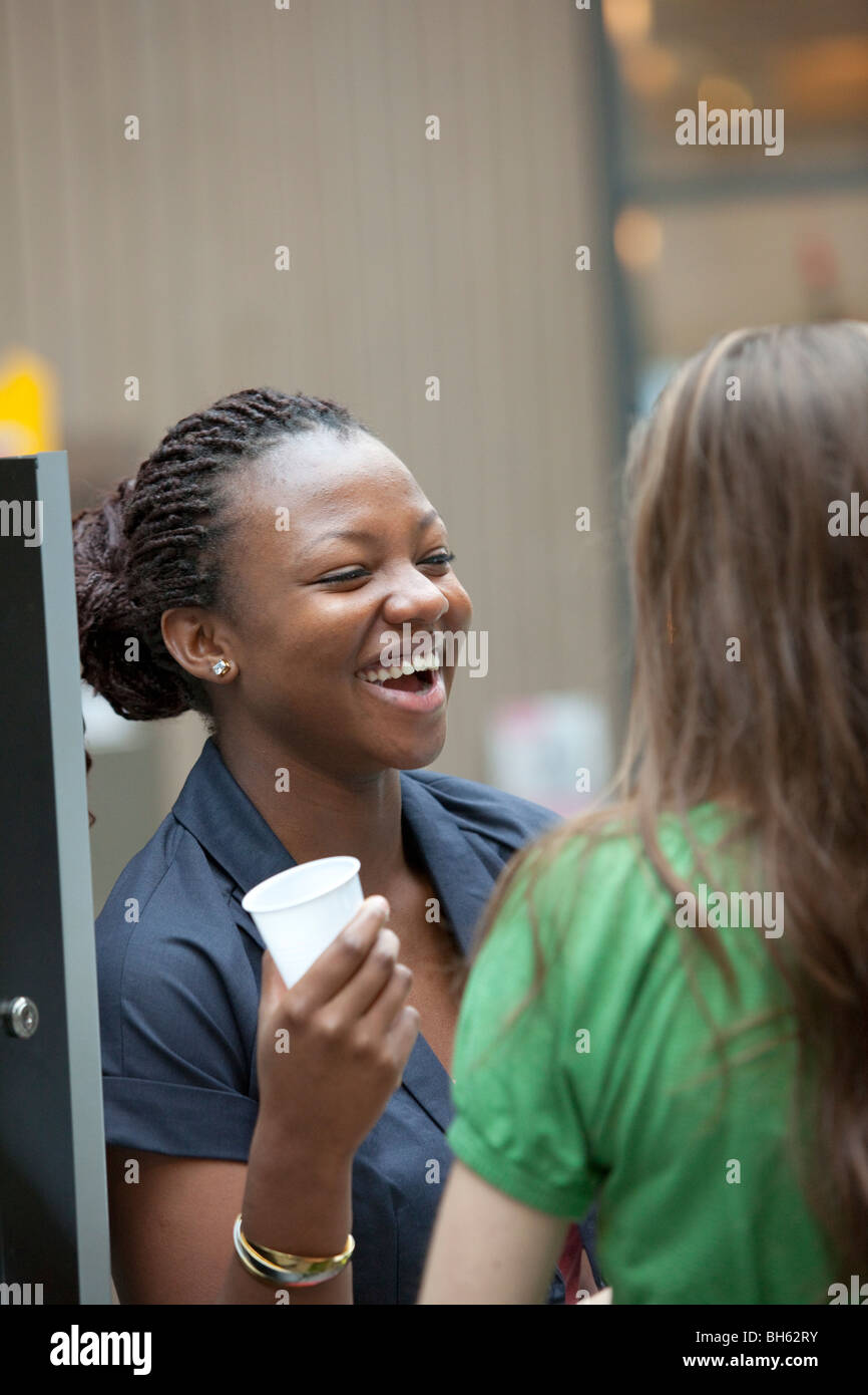 Two teenagers laughing indoors hi-res stock photography and images - Alamy