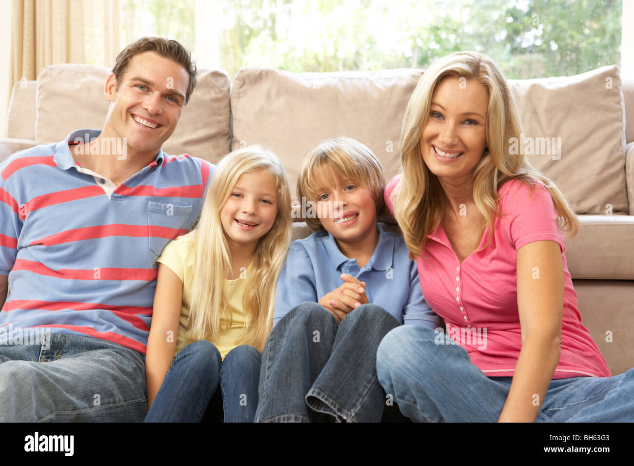 Family Relaxing At Home Together Stock Photo - Alamy