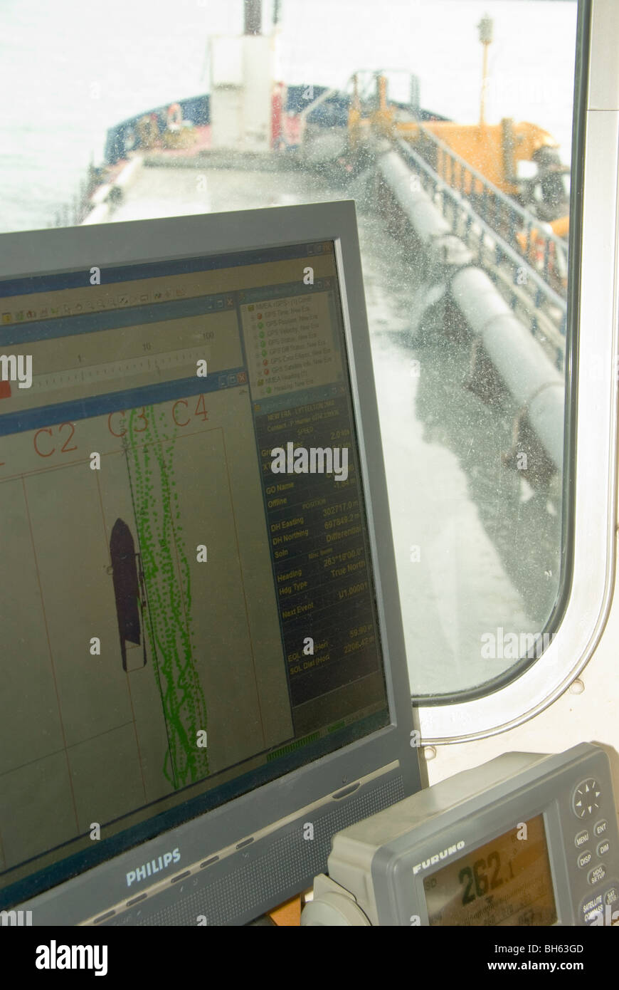 An electronic GPS track plotter in use on a dredgerdreding mud from the ...