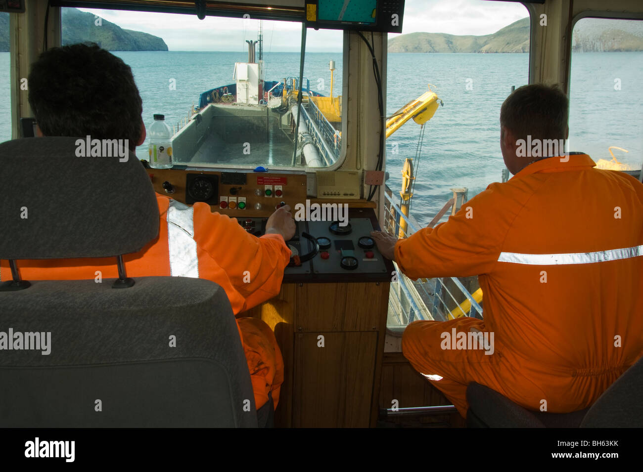 Bridge team on a dredger control vessel during dredging operations ...