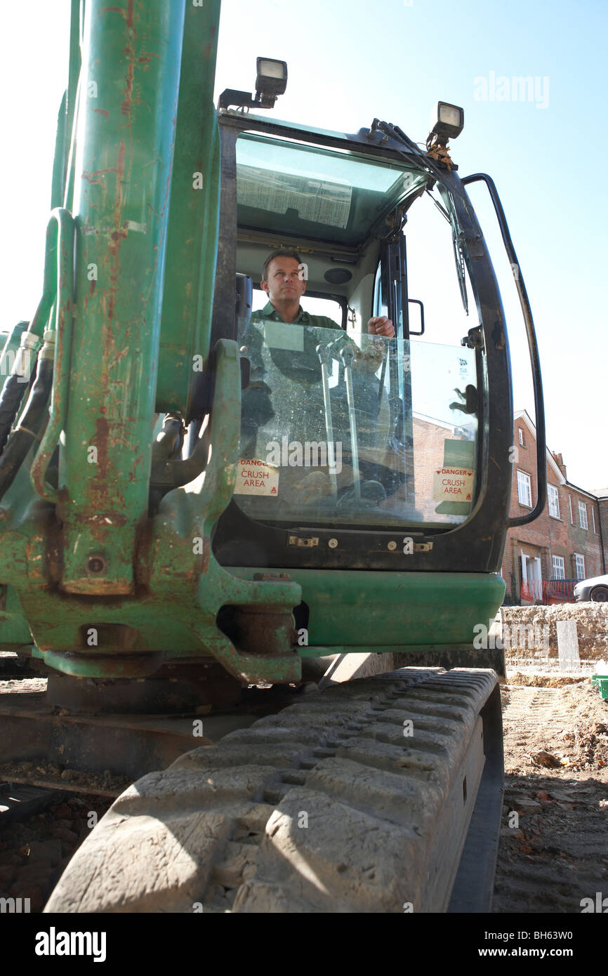 Construction Worker Using Digger Stock Photo - Alamy