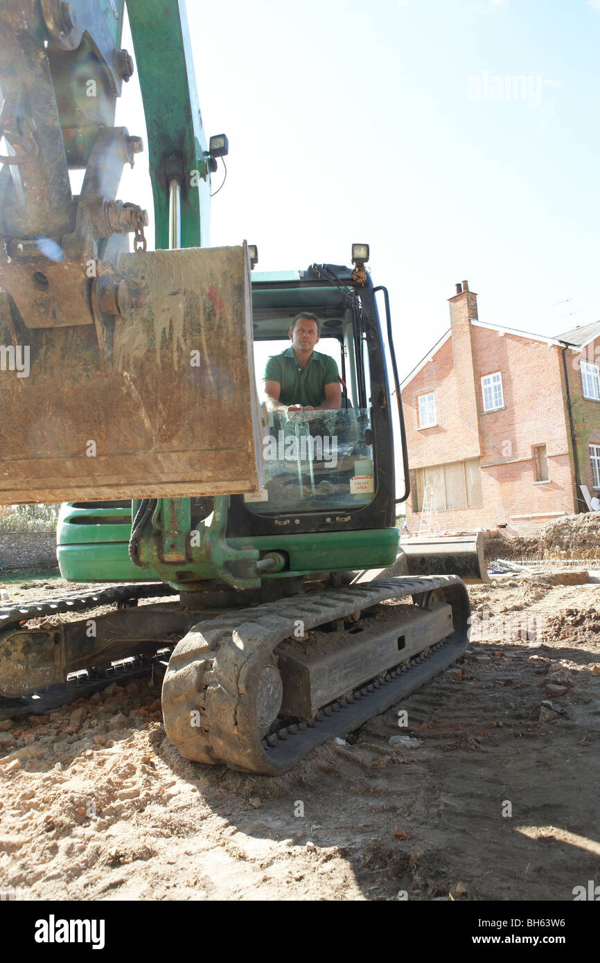 Construction Worker Using Digger Stock Photo - Alamy