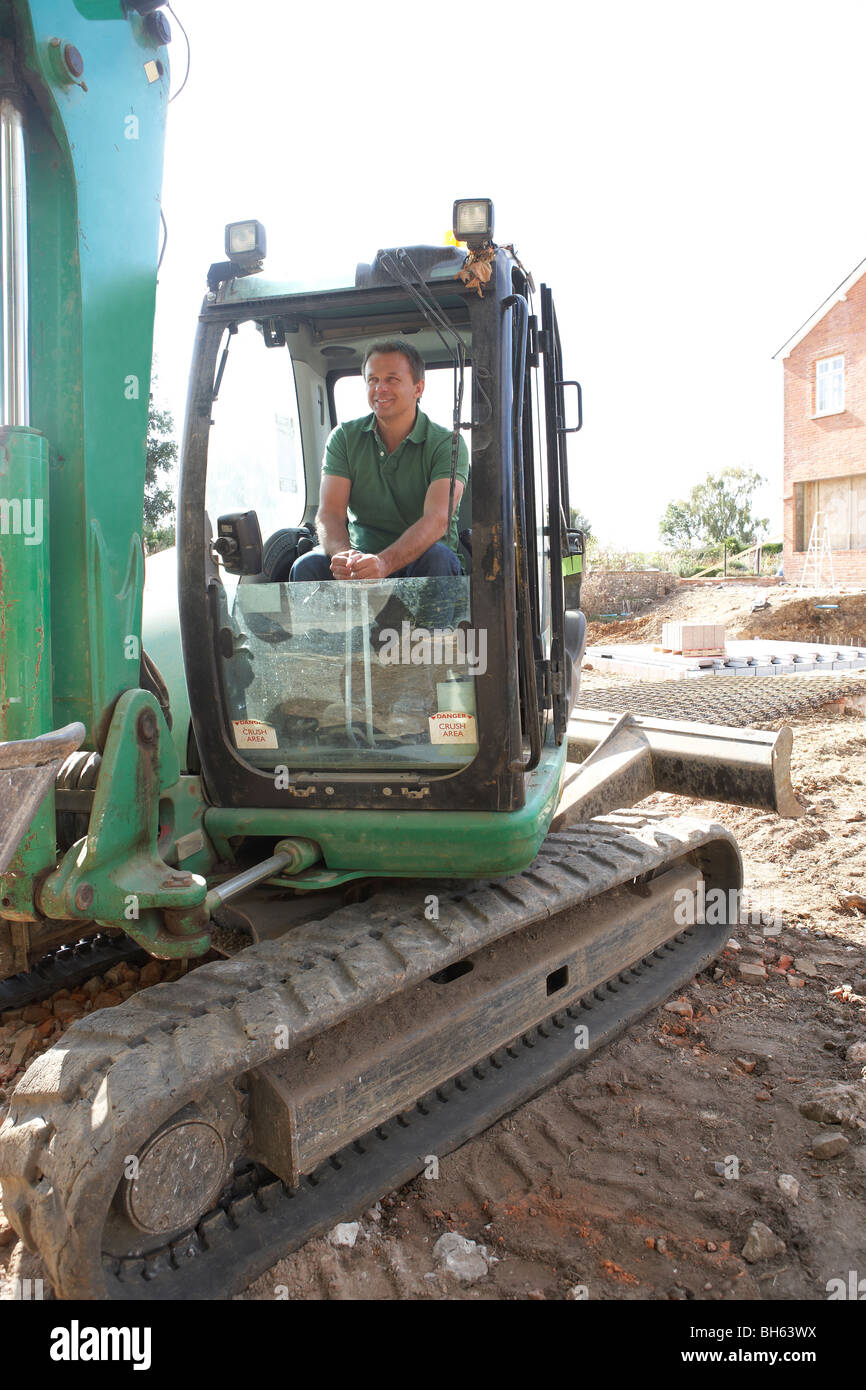 Construction Worker Using Digger Stock Photo - Alamy
