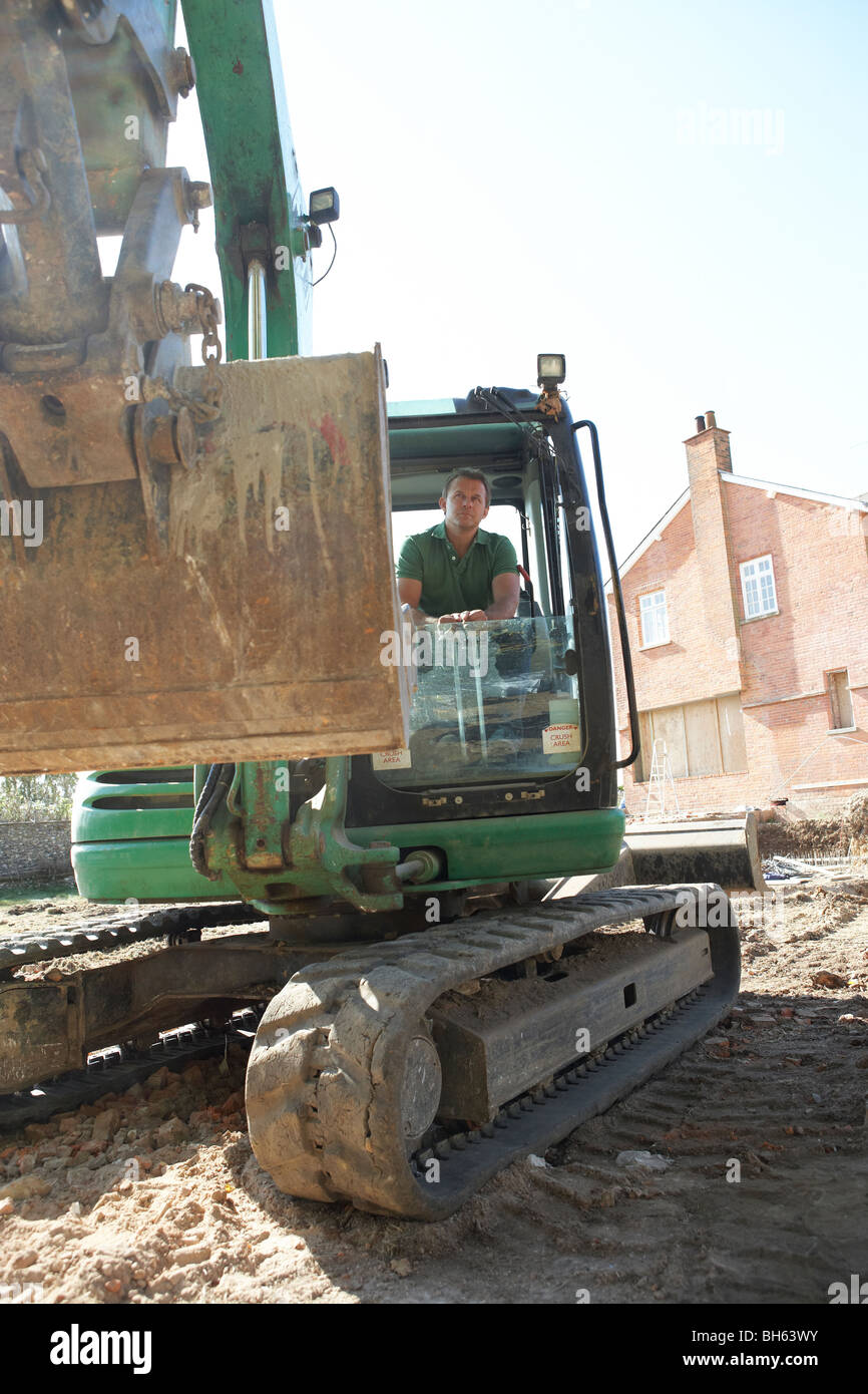 Construction Worker Using Digger Stock Photo - Alamy