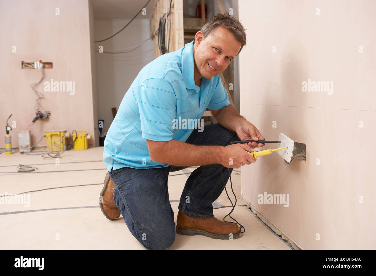 Electrician Installing Wall Socket Stock Photo - Alamy
