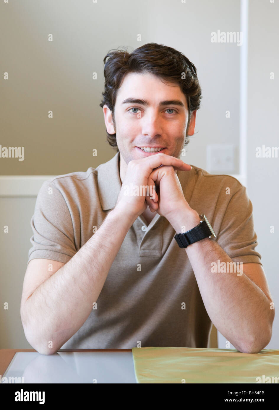 Man sitting at table Stock Photo - Alamy