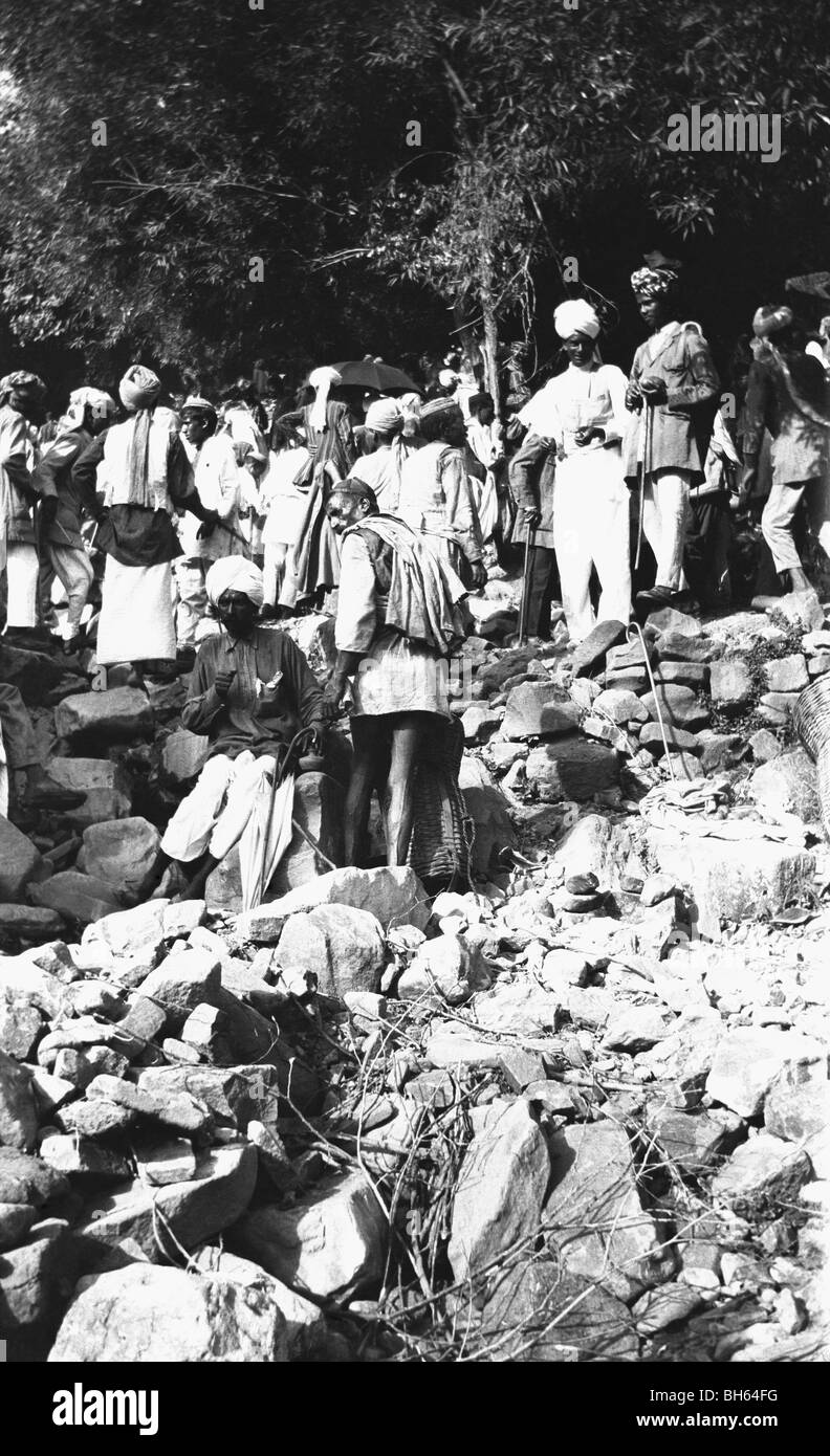 crowd standing on rubble Stock Photo - Alamy