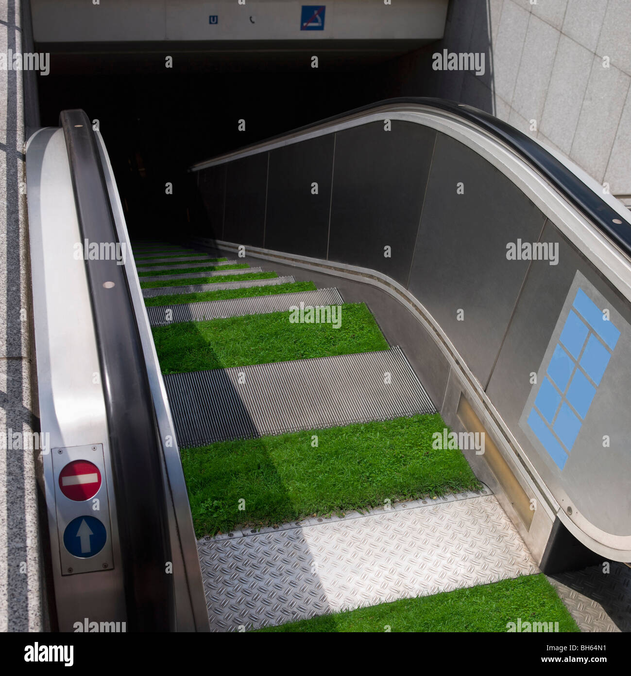 Grass on escalator Stock Photo - Alamy