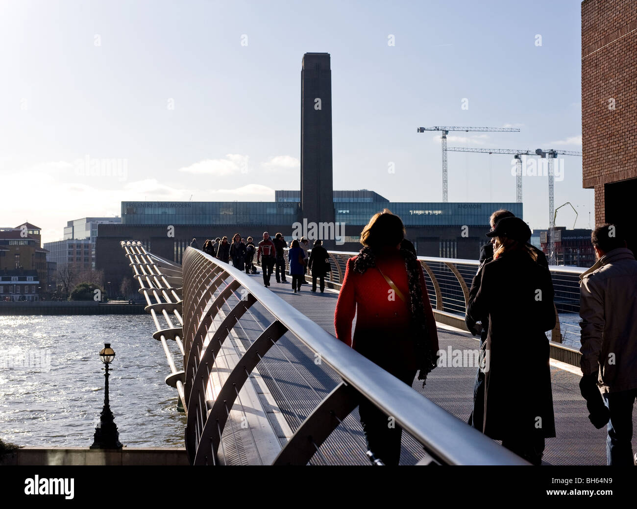 People walking across the Millenium Bridge in London. Photo by Gordon ...