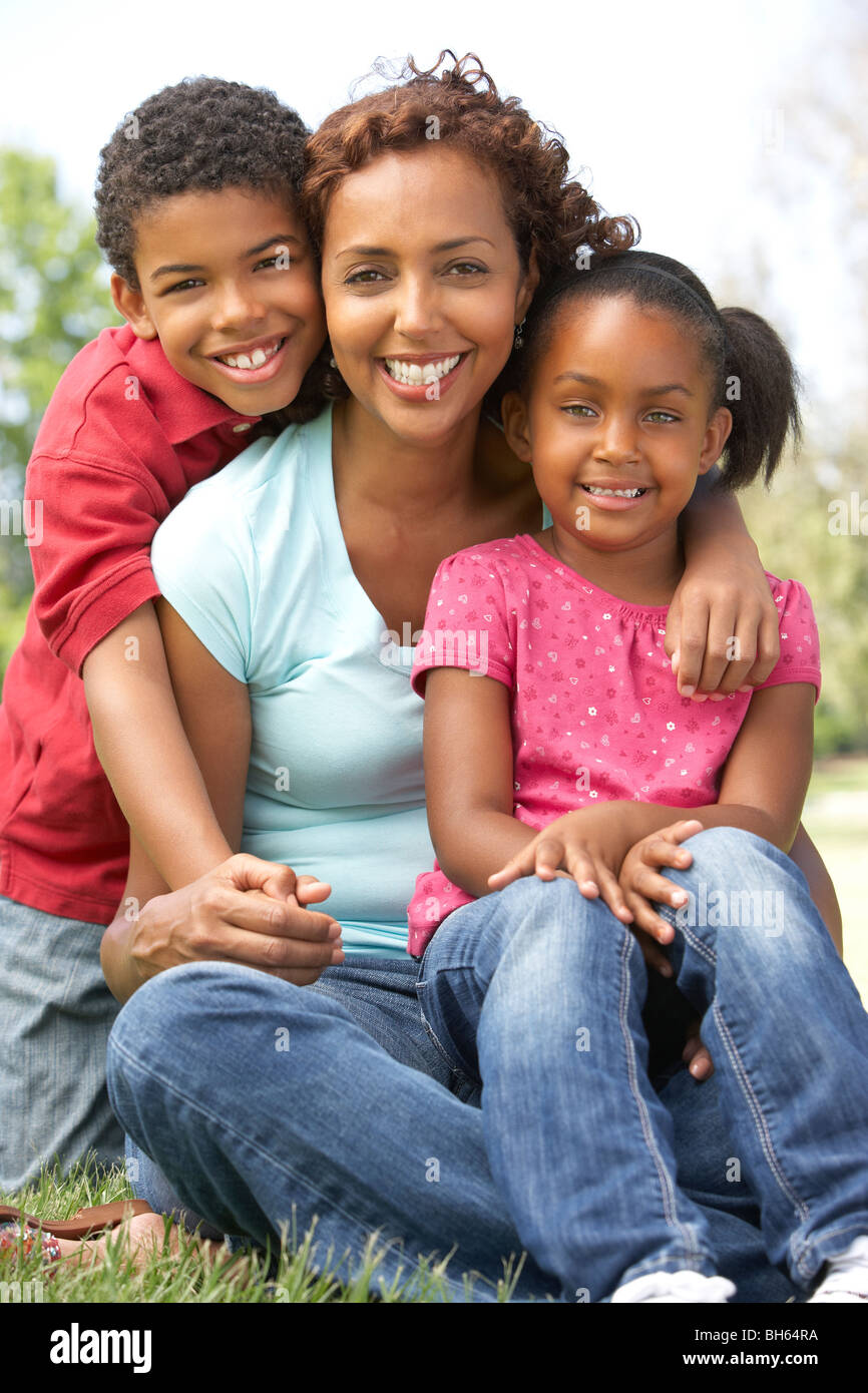 Mother With Children In Park Stock Photo - Alamy