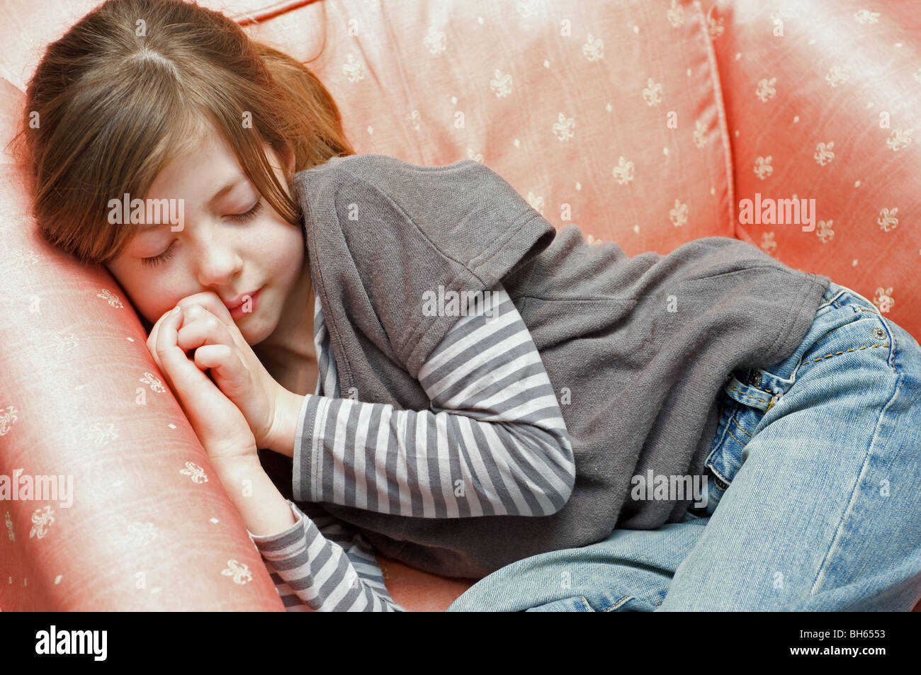 Young girl at home asleep in a chair Stock Photo - Alamy