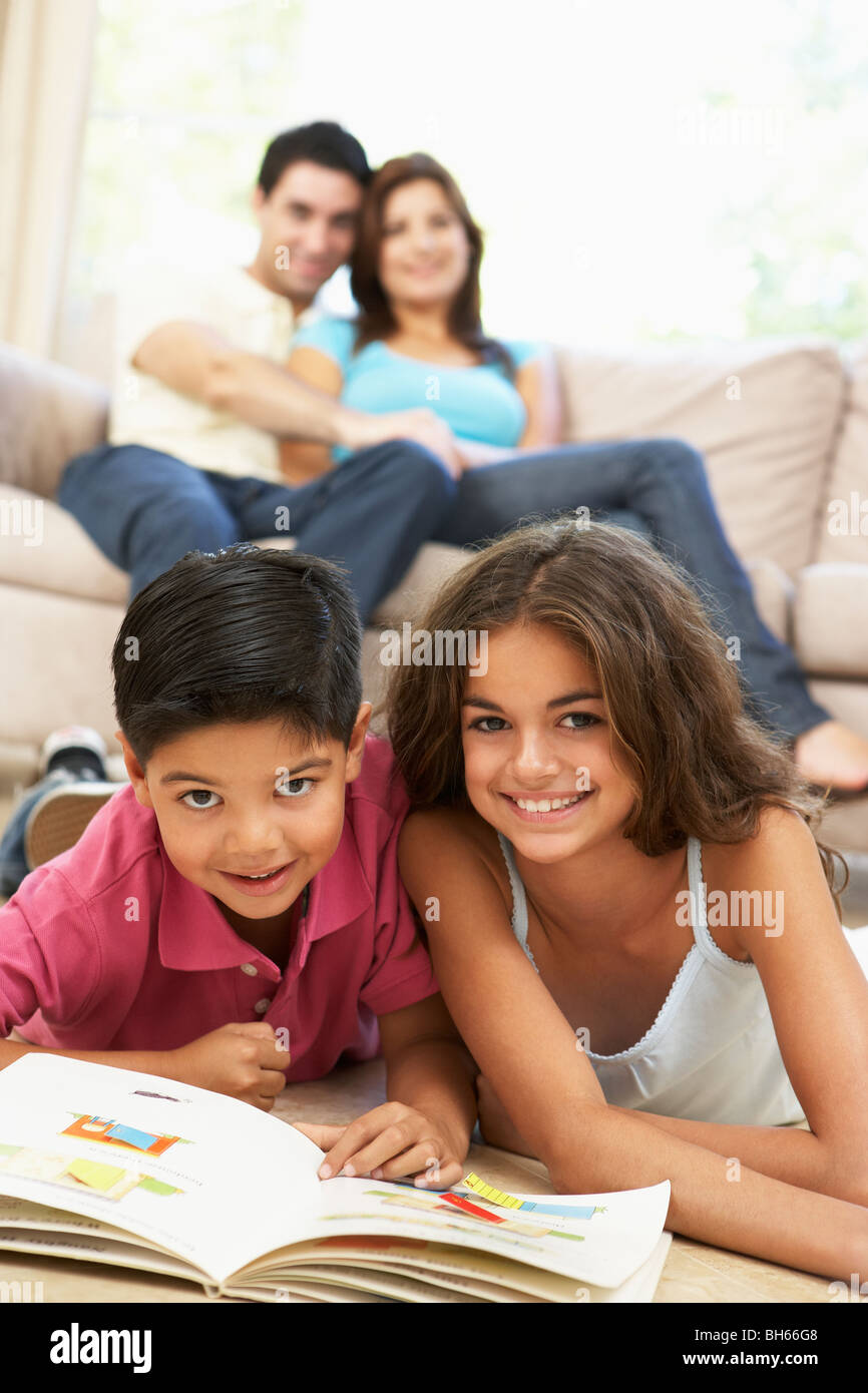 Children Reading Book At Home Stock Photo - Alamy