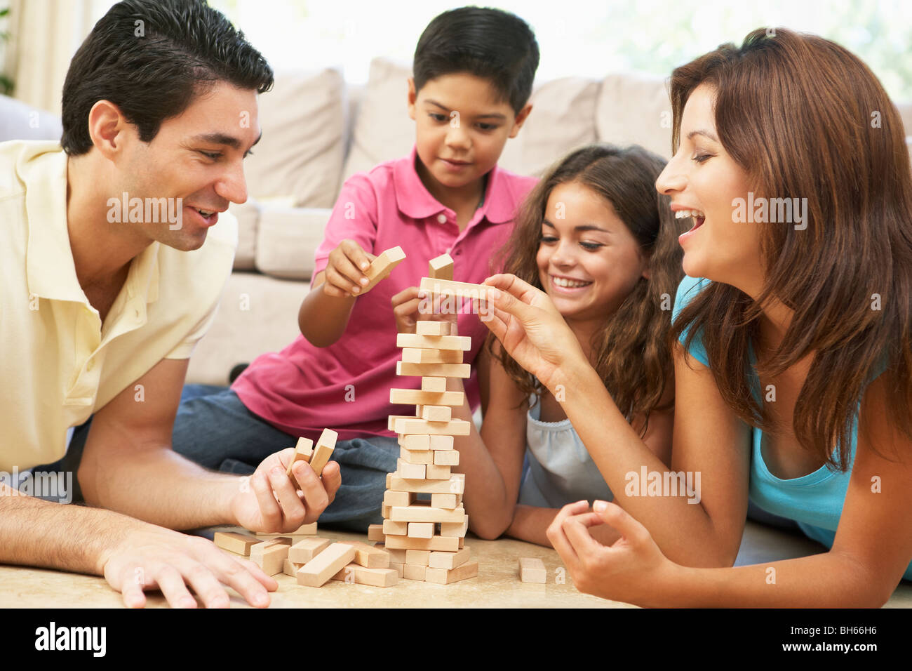 Family Playing Game Together At Home Stock Photo - Alamy