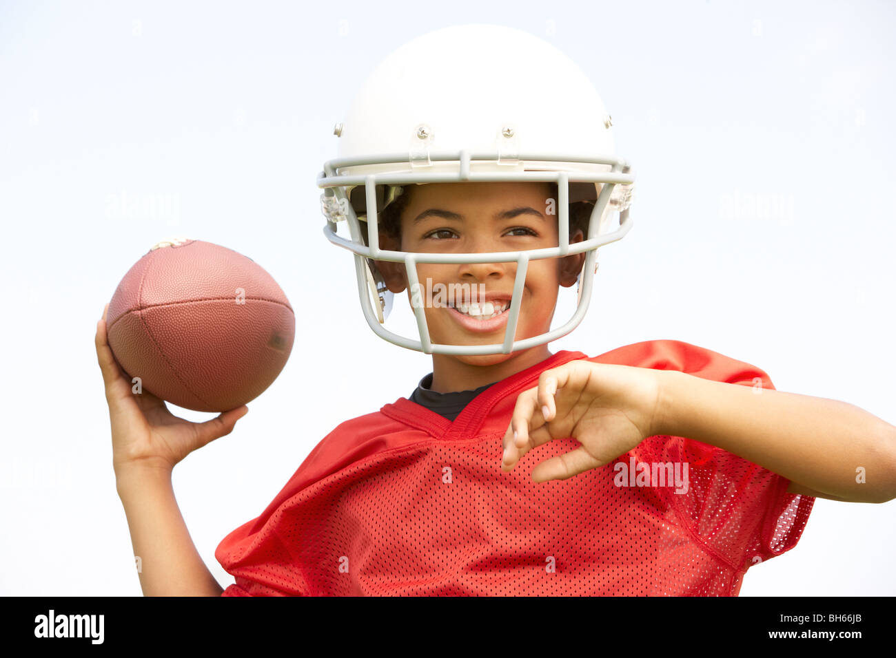 Young Boy Playing American Football Stock Photo - Alamy