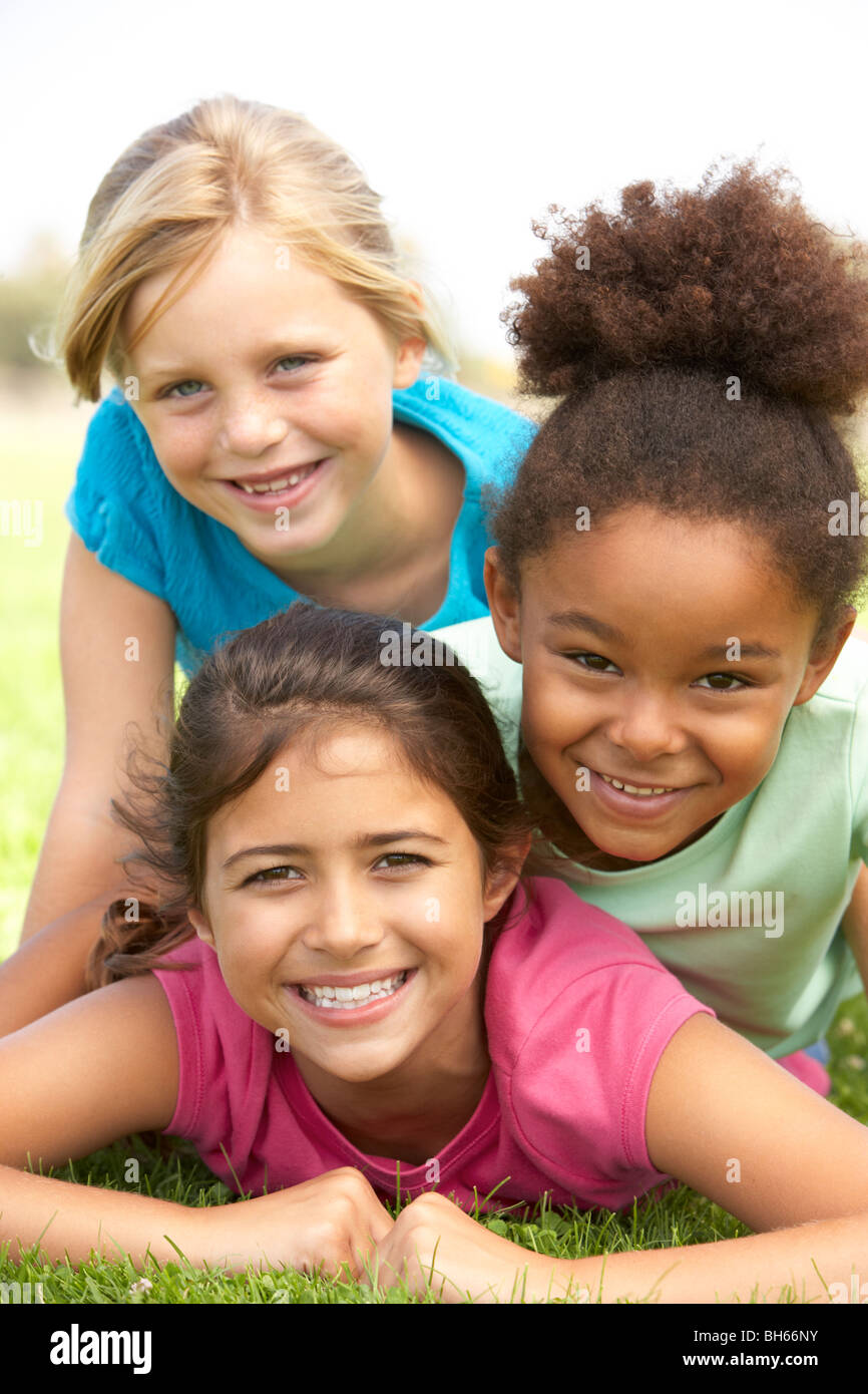 Young Girls In Playing In Park Stock Photo - Alamy
