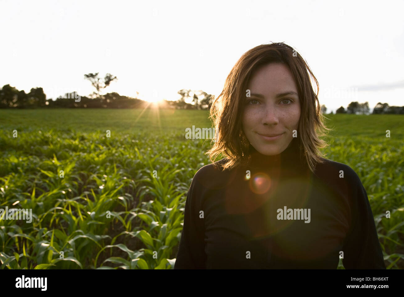 Woman standing between sun hi-res stock photography and images - Alamy