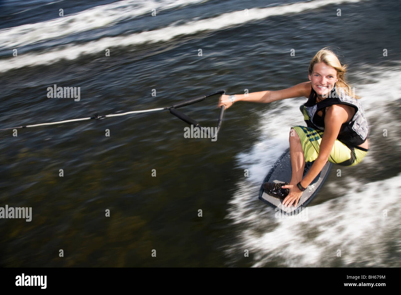 Young adult woman wakeboarding hi-res stock photography and images - Alamy