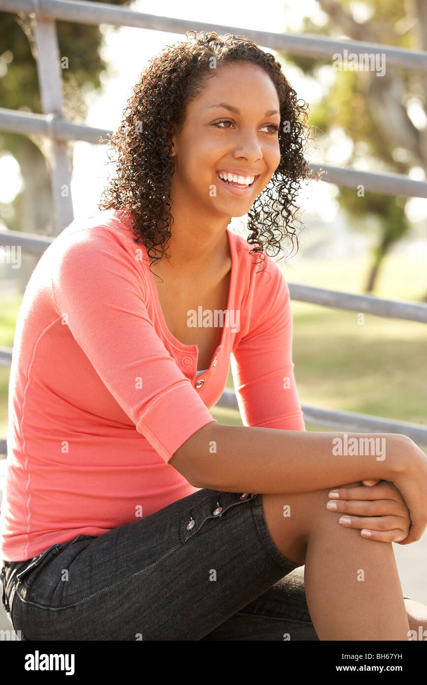 Teenage Girl Sitting On Steps Stock Photo - Alamy