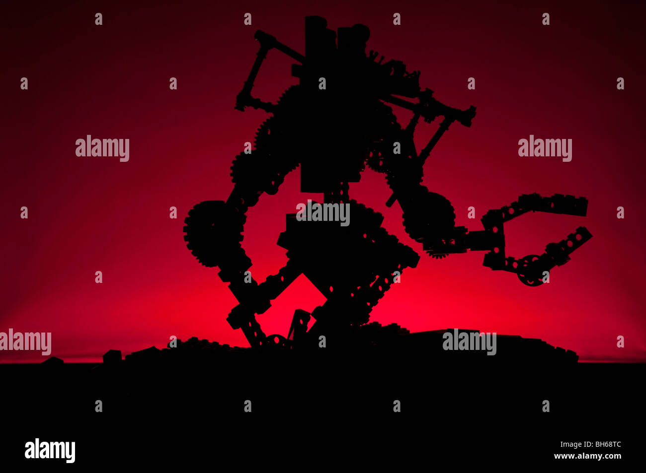 Lego Robot Standing On Mound Of Black Lego Stock Photo - Alamy