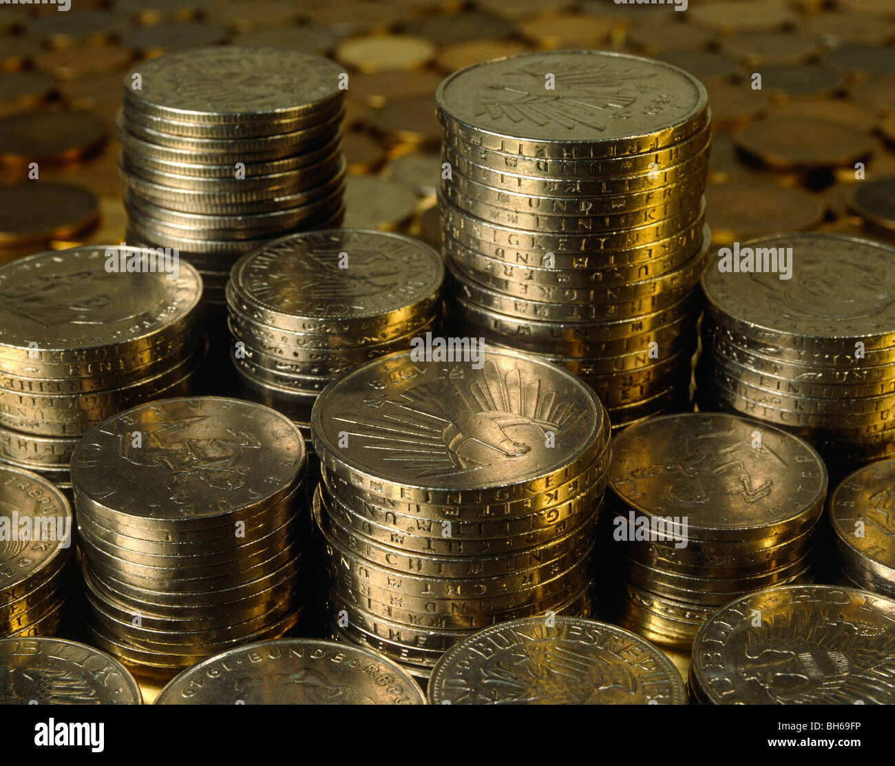 Piles of coins Stock Photo - Alamy