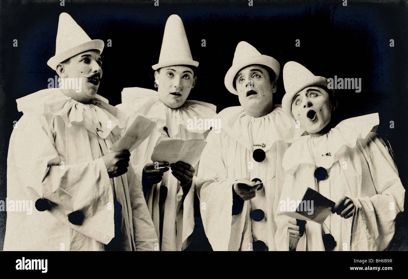 Four Clowns Singing in Unison from Song Sheets Stock Photo - Alamy