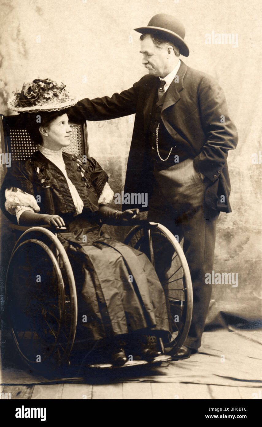 Couple with Disabled Wife in Wheelchair Stock Photo - Alamy