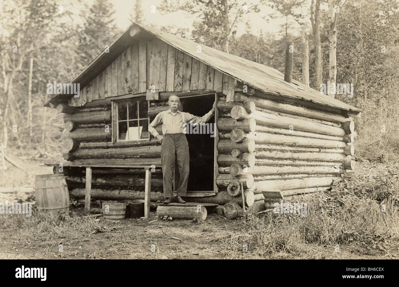 Older Man at Log Cabin Dwelling Stock Photo - Alamy