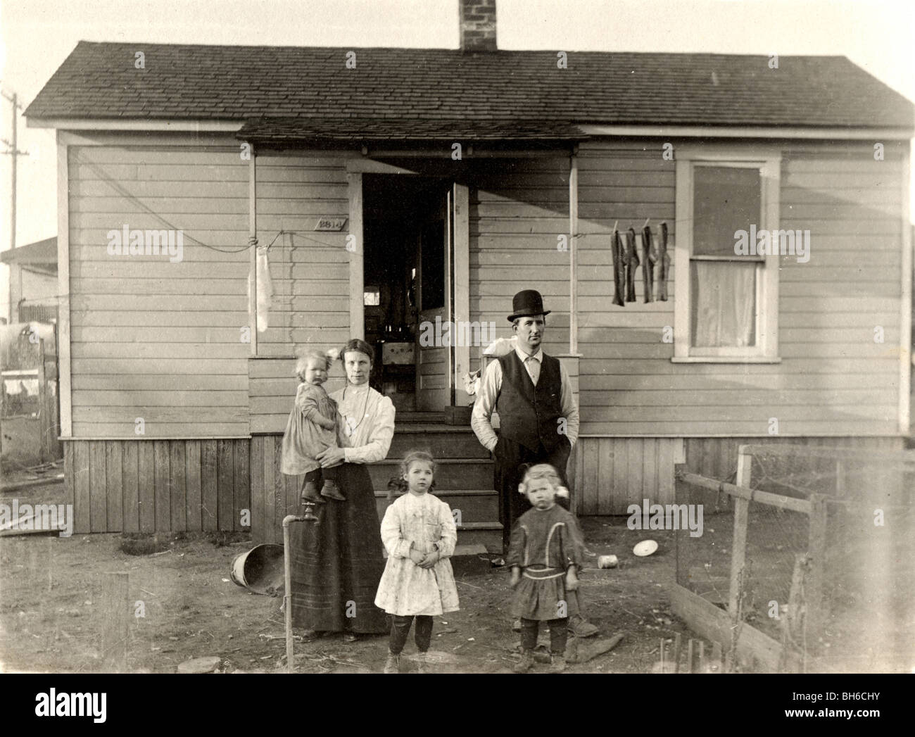 Family of Five at Small Shanty Stock Photo - Alamy