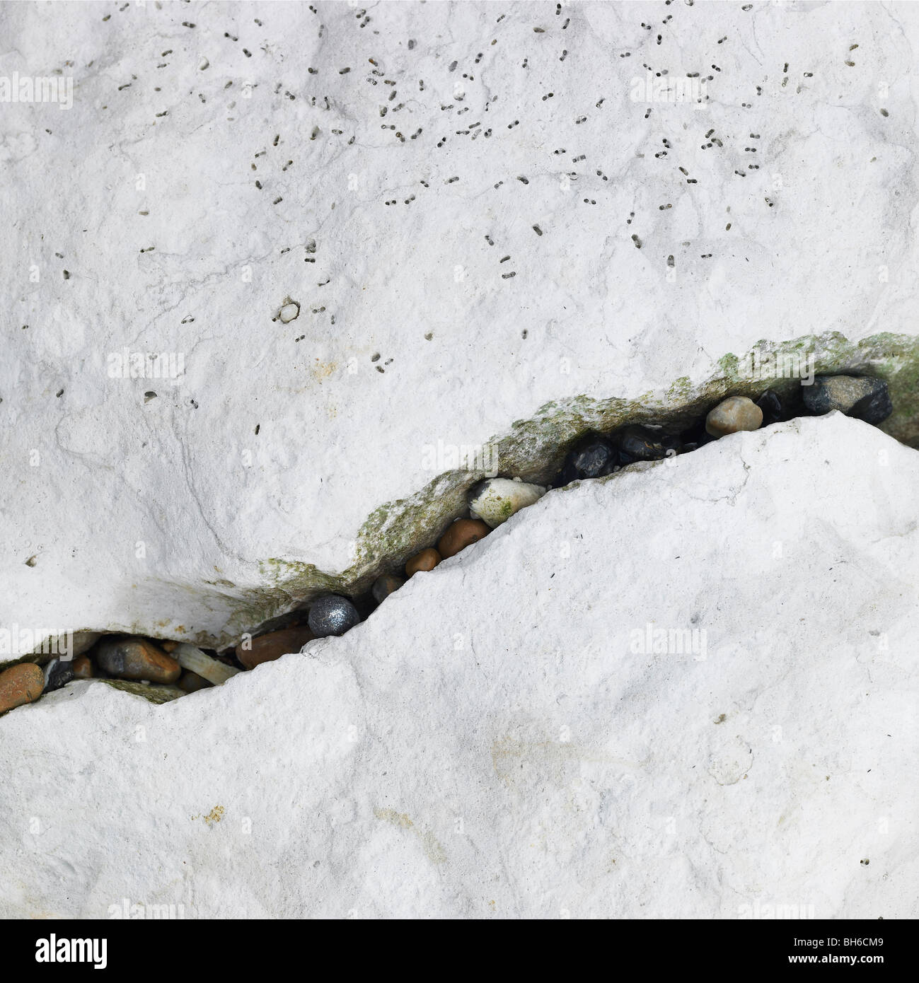 pebbles in chalk crack Stock Photo - Alamy