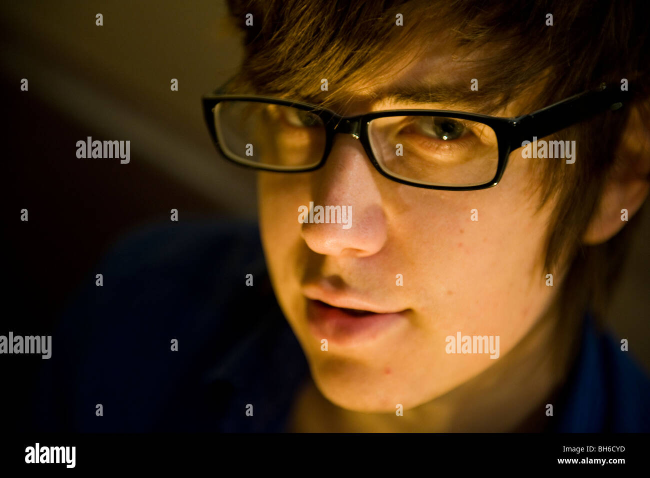 A young man wearing glasses Stock Photo - Alamy