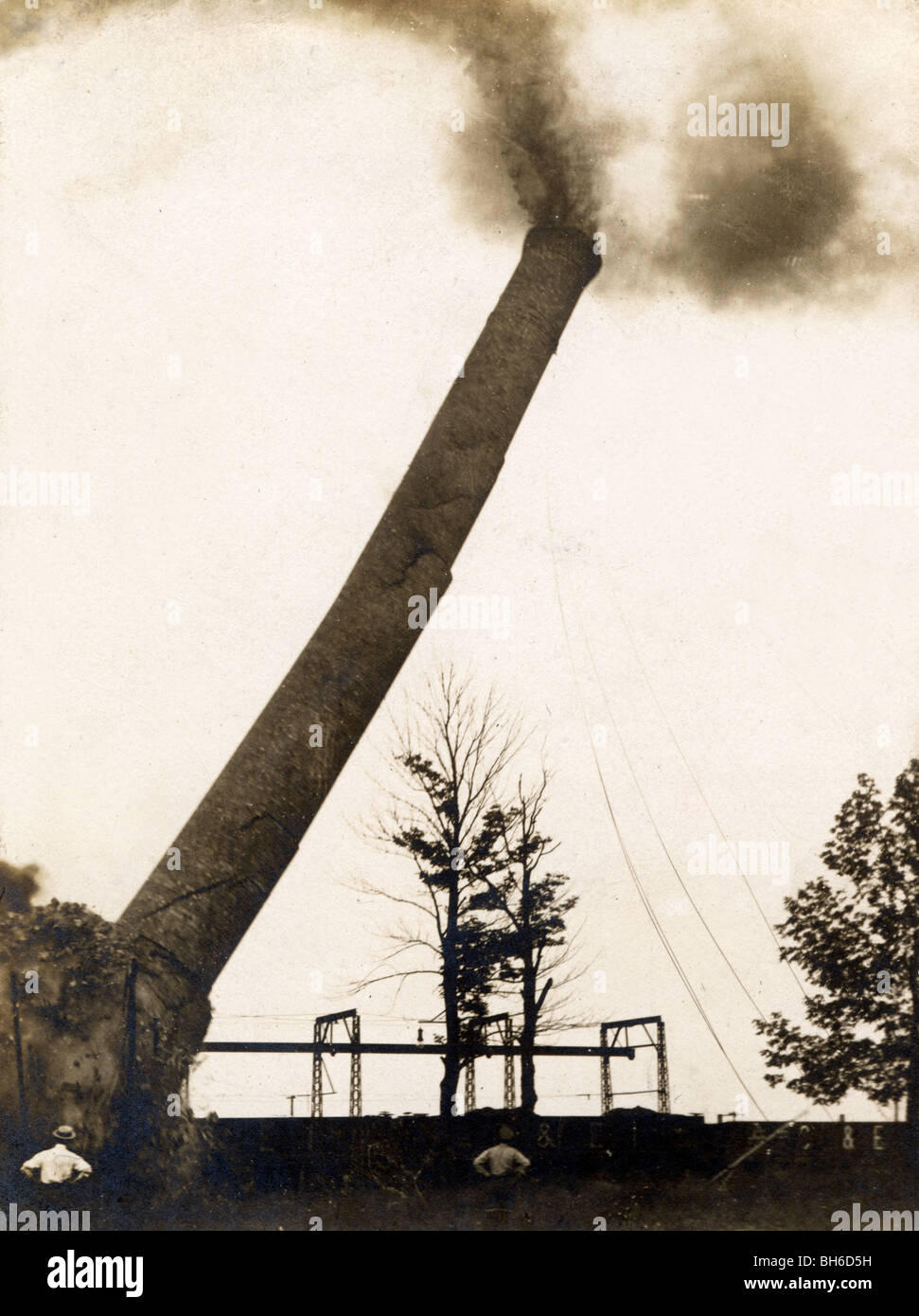 Giant Smokestack Still Smoking, Being Pulled Down Stock Photo - Alamy