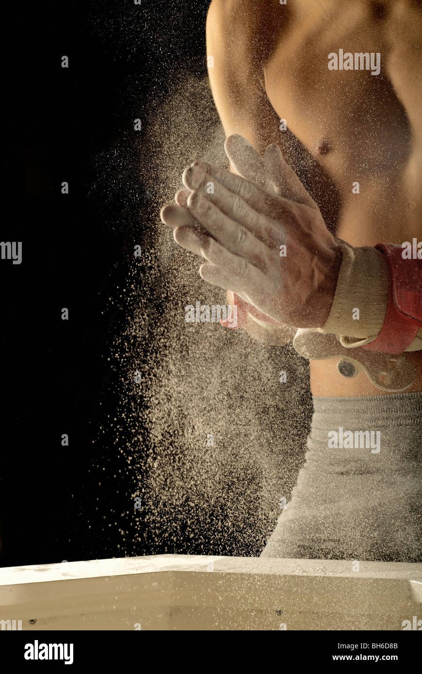 gymnast clapping hands in chalk Stock Photo - Alamy
