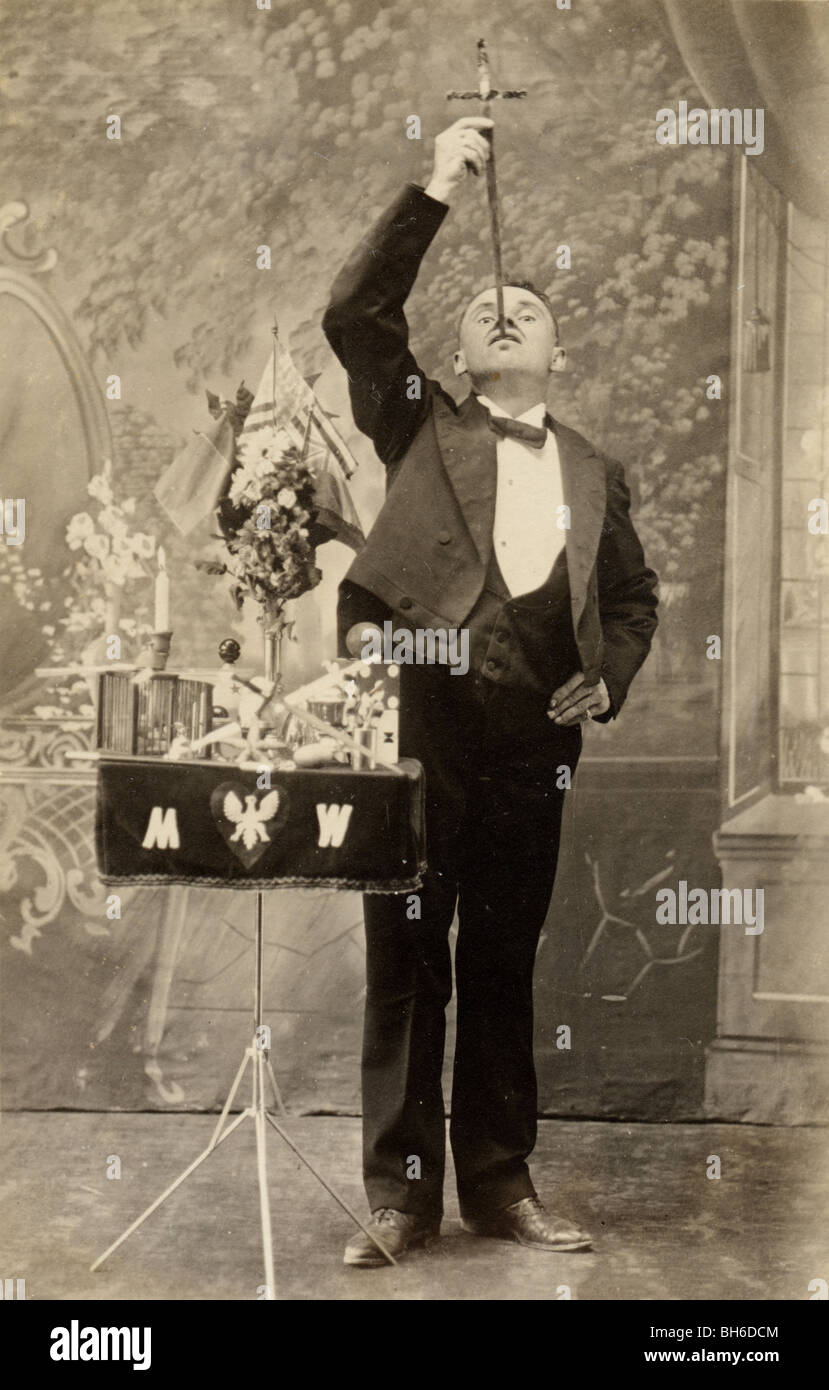 Magician Performing Sword Swallowing Trick Stock Photo - Alamy