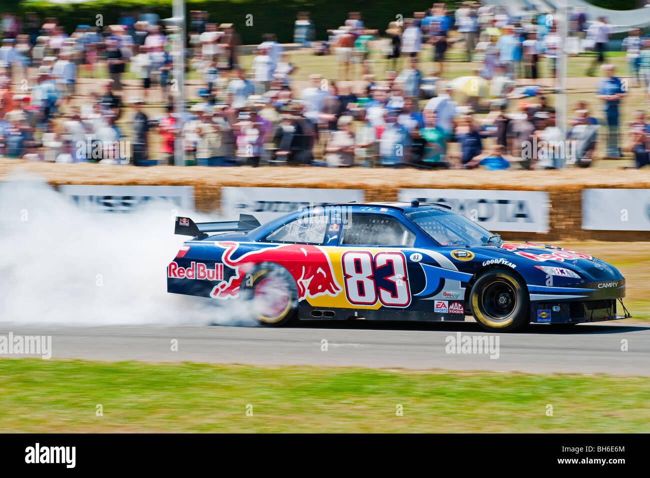 Toyota Camry spinning its rear wheels at Goodwood during the Festival ...