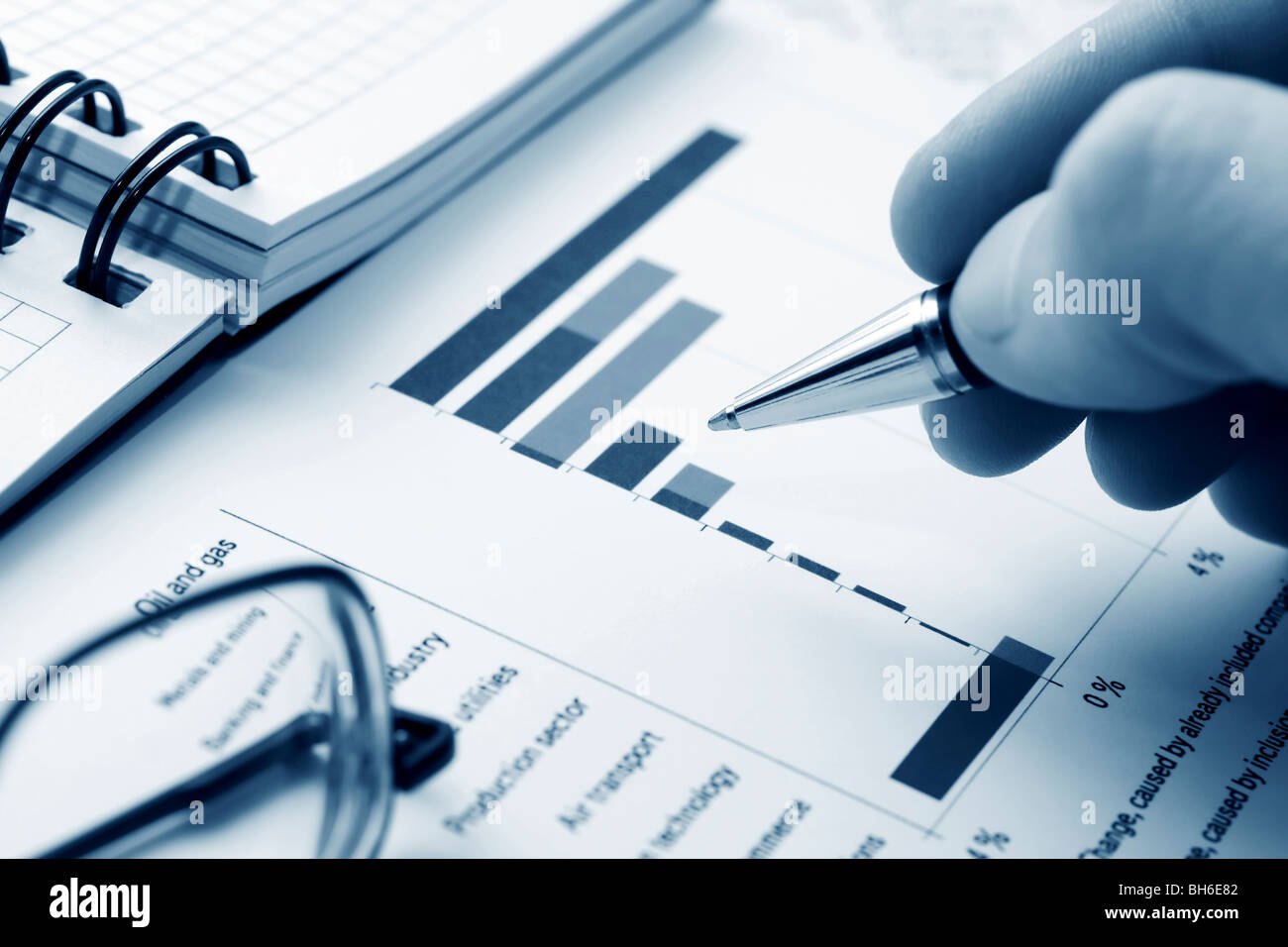 Financial work with stock market reports Stock Photo - Alamy