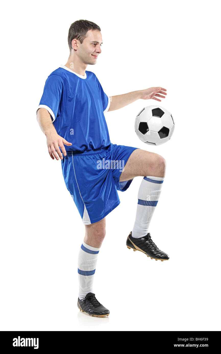 Soccer player with a ball isolated against white background Stock Photo ...