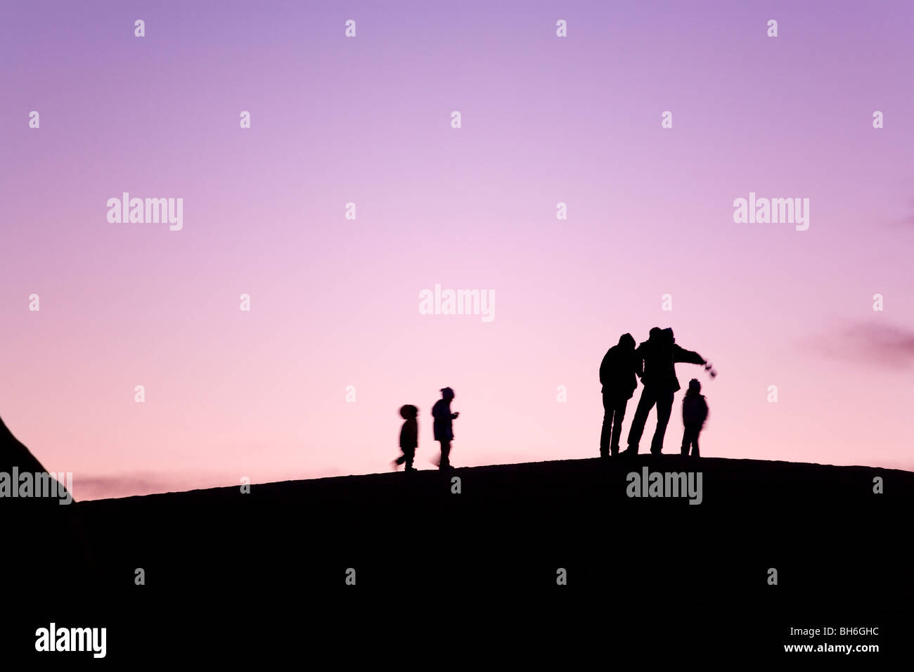 Family gathering after Sunset Stock Photo - Alamy