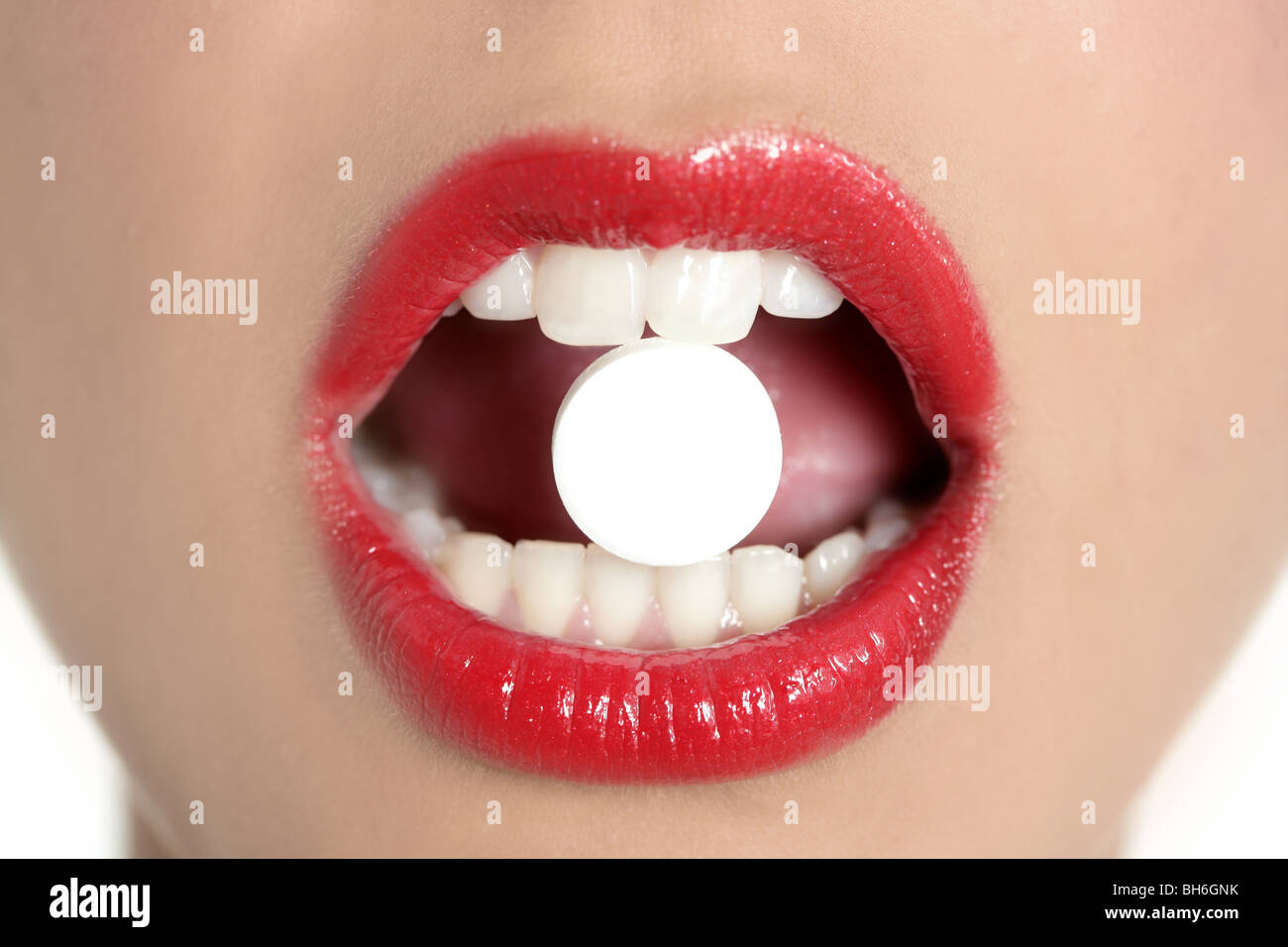 Beauty woman mouth with red lips and medicine pill Stock Photo - Alamy